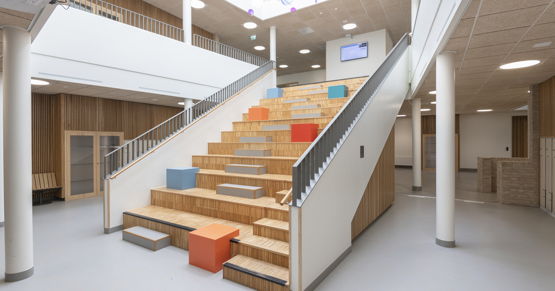 New school building and sports hall with distinctive acoustic ceiling ...